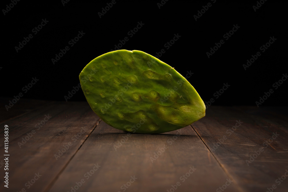still life image of one organic nopal pad from Mexico. Raw and clean no ...