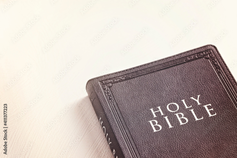 Holy Bible on a Textured White Surface Stock Photo | Adobe Stock