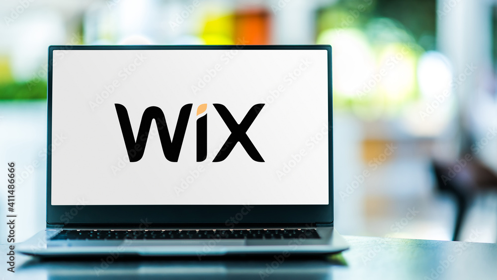 Laptop computer displaying logo of Wix Stock Photo | Adobe Stock