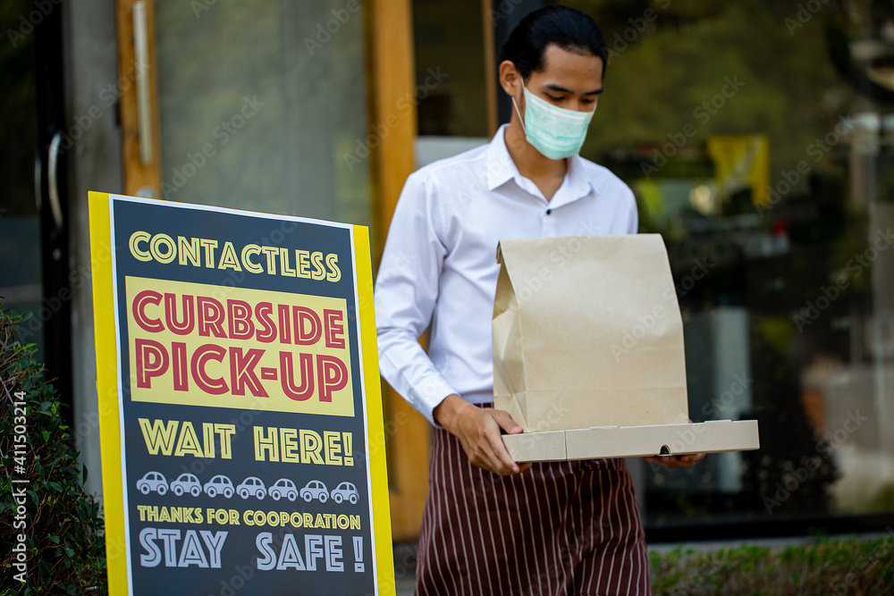 Curbside pick up.Store worker wear mark and bring foods from customer ...