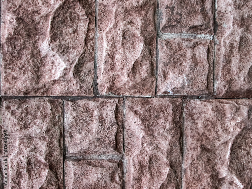 Convex ribbed stones of a pale pink hue. Contemporary textured stone ...