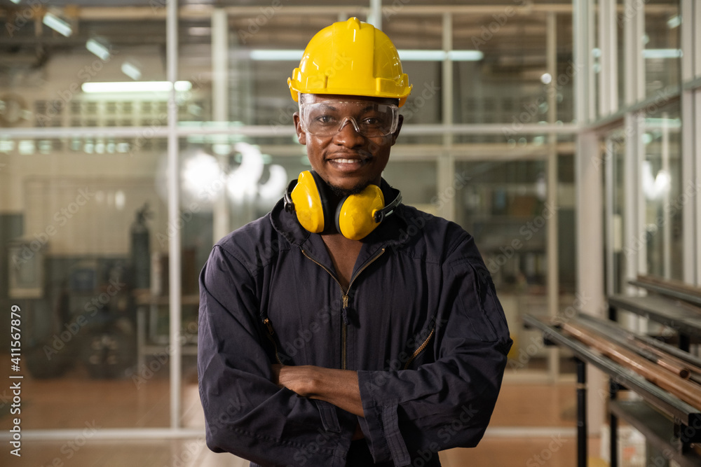 Confidence African American engineer or worker crossing his arms and ...