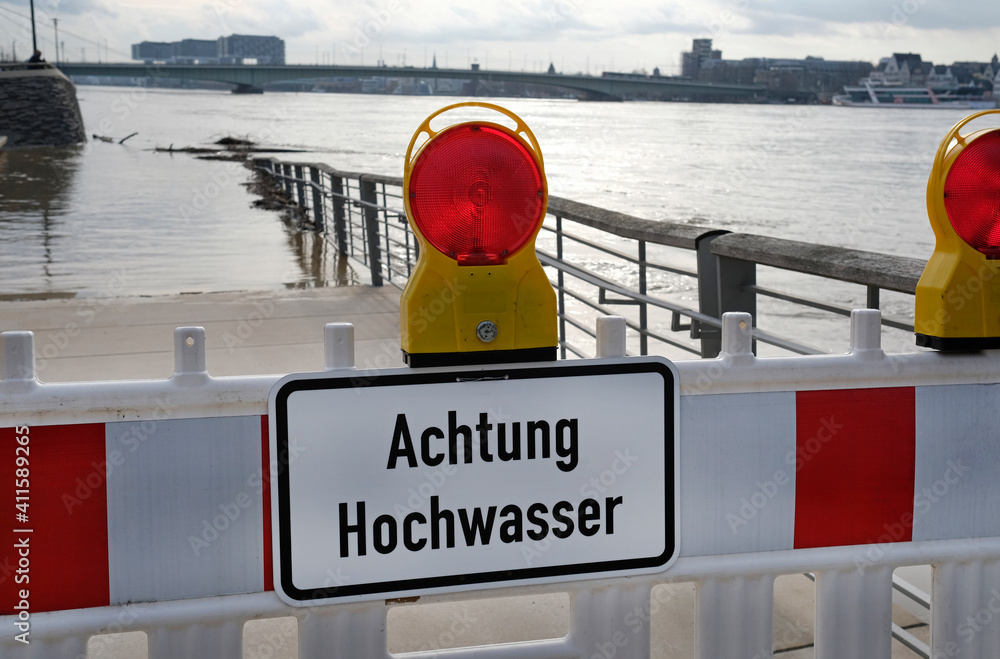 Extreme weather: Warning sign in German at the entrance to a flooded ...