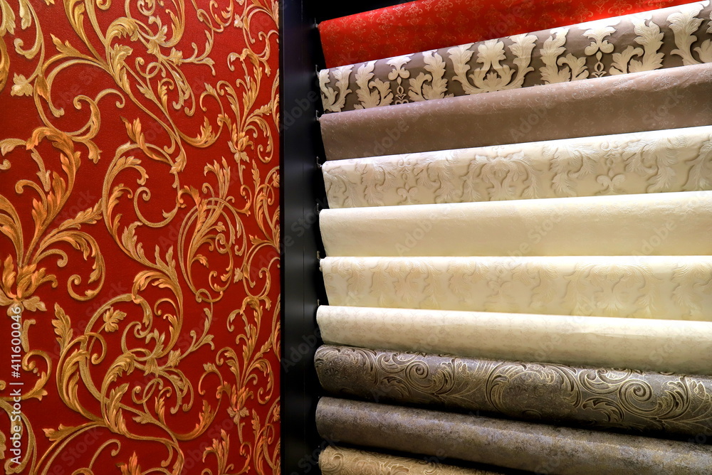 Rolls of vinyl wallpaper in a building supermarket, store, market ...