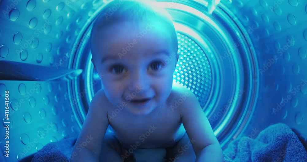 Vidéo Stock Cute Kid Boy Having Fun at Home Inside Washing Machine ...