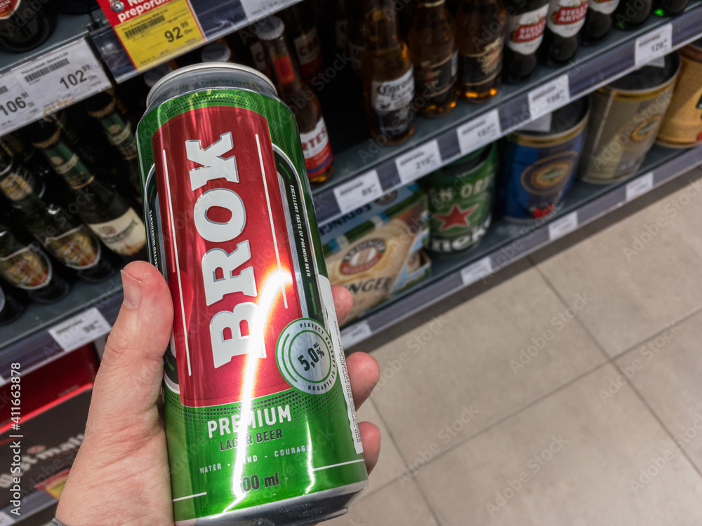 BELGRADE, SERBIA - JANUARY 28 2021: Hands holding a can of Brok beer ...