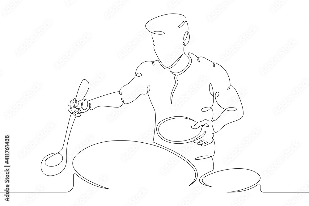 Chef prepares food in the kitchen. Male cook in uniform with kitchen ...