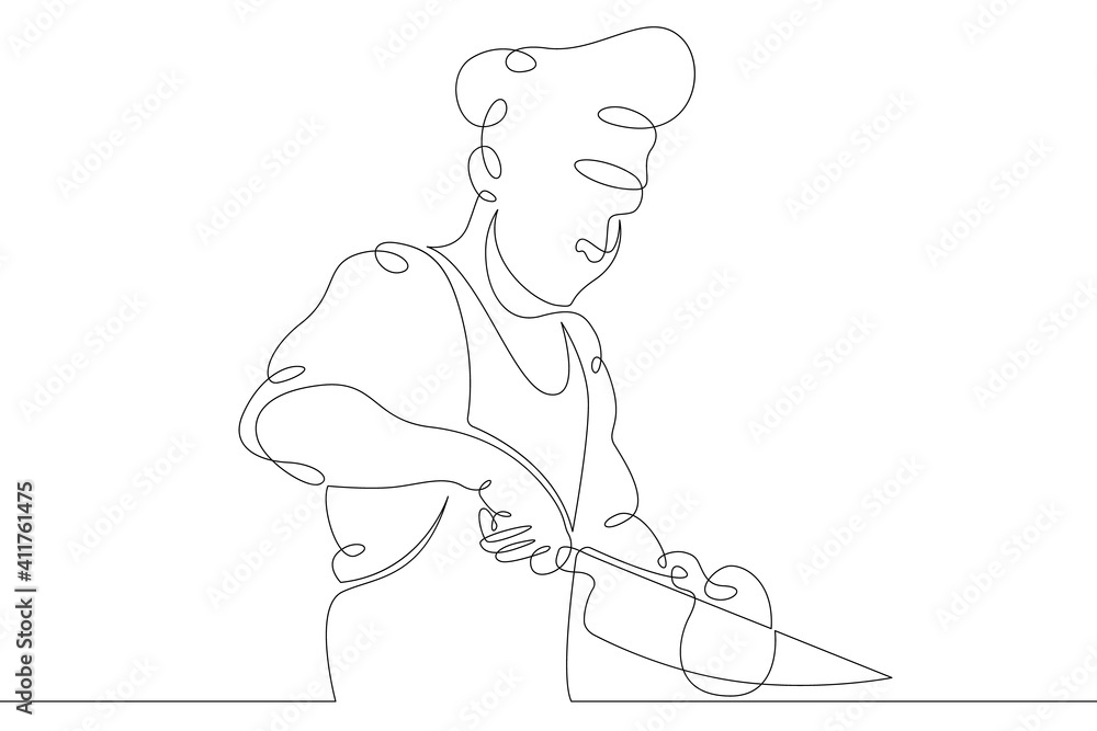 Chef prepares food in the kitchen. Male cook in uniform with kitchen ...
