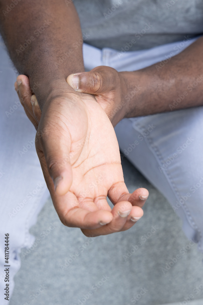 African man suffering from wrist or hand pain, sick black man with CTS ...