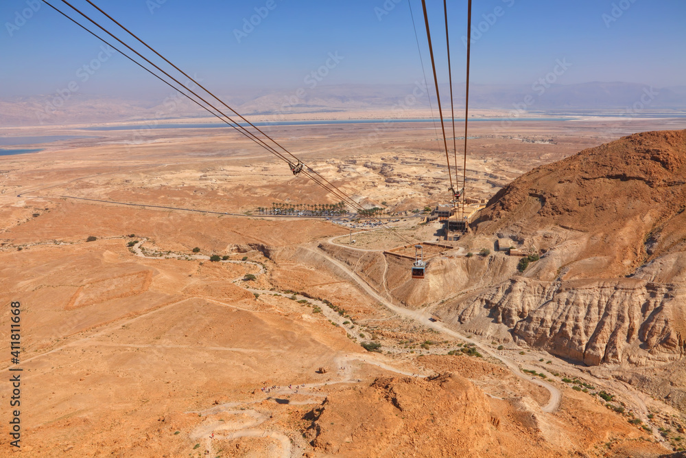 Cableway from rock top of Fortress Masada (1st century). Cable car over ...