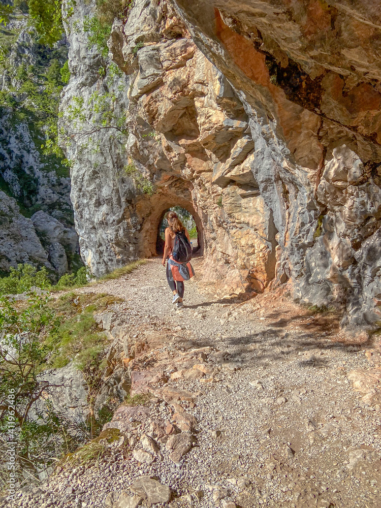Cain, Spain - September 1, 2020: Female hiking trough the Cares Route ...