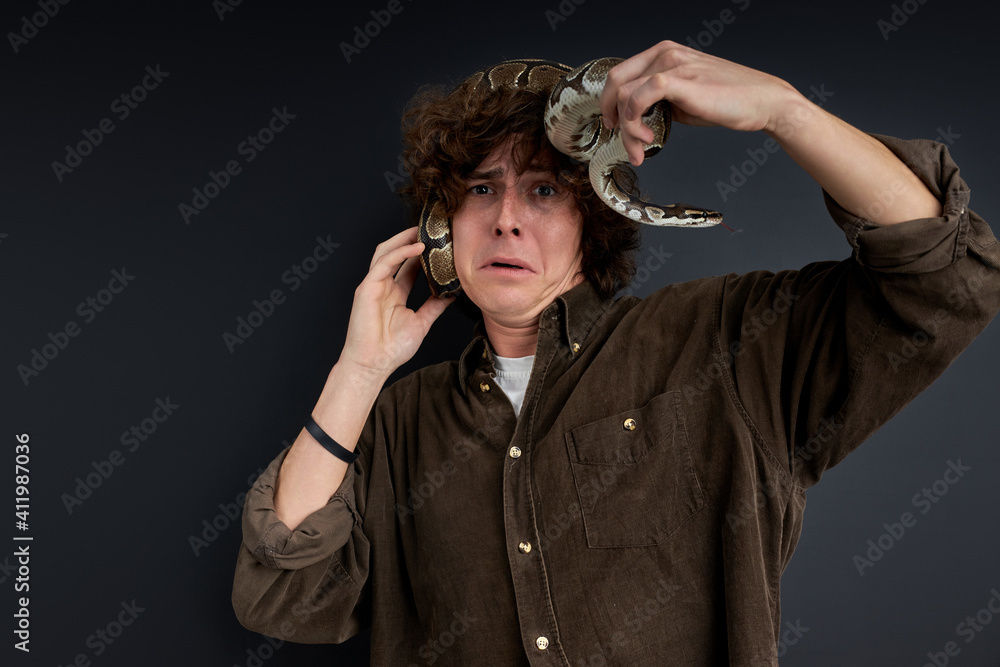 man has a panic, he is trying to remove a live snake from himself ...