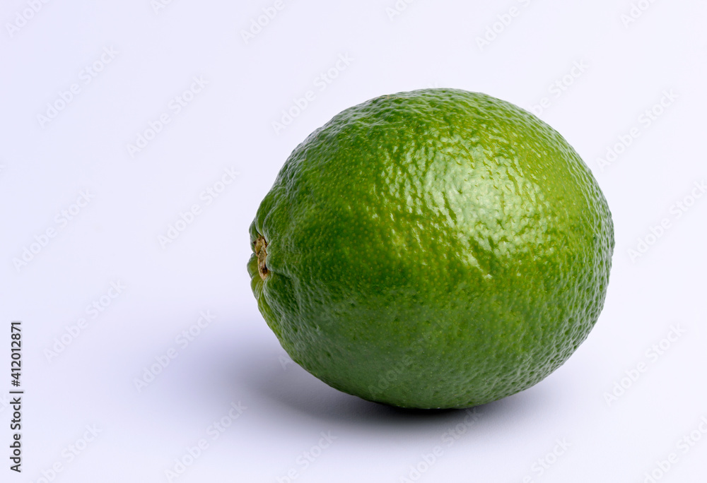 A single lime on a white background Stock Photo | Adobe Stock