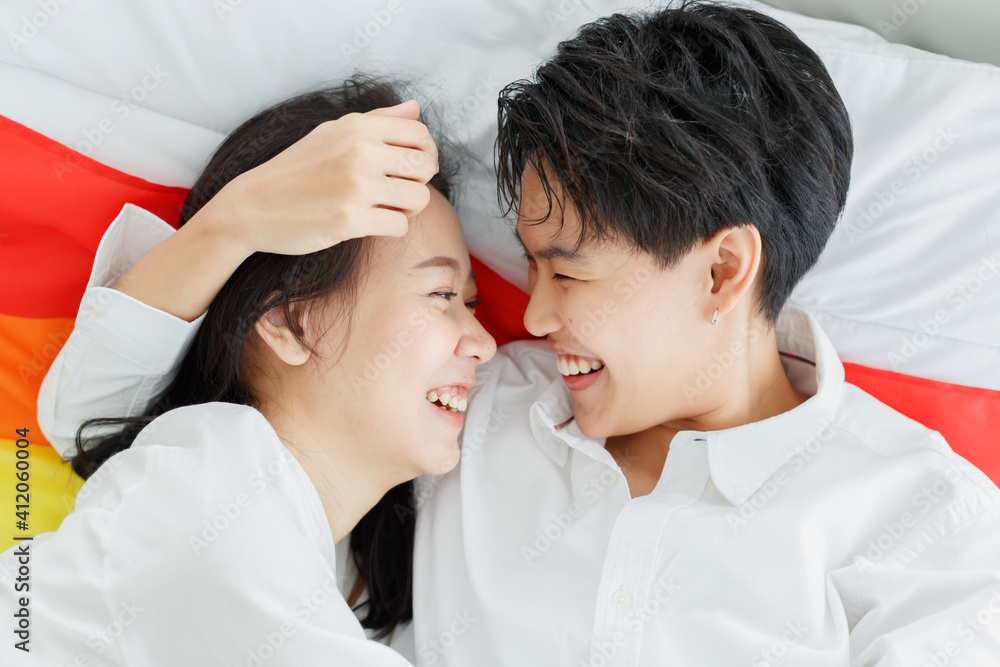 Foto de LGBTQ couple lovers, a handsome girl as man or butch hold and ...