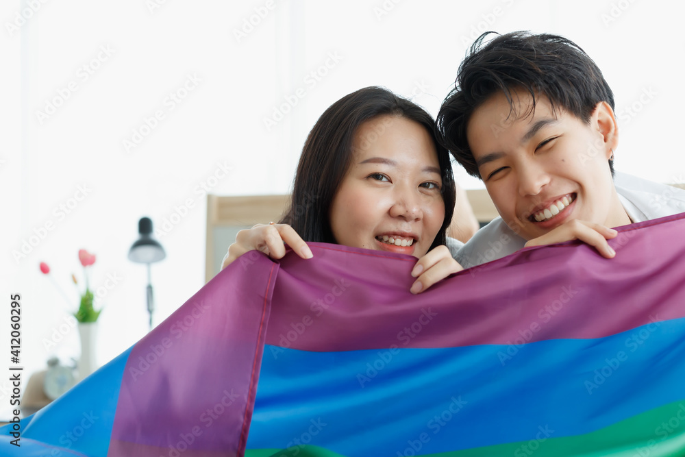 LGBTQ couple lovers, a handsome girl as a man or butch femme girl ...