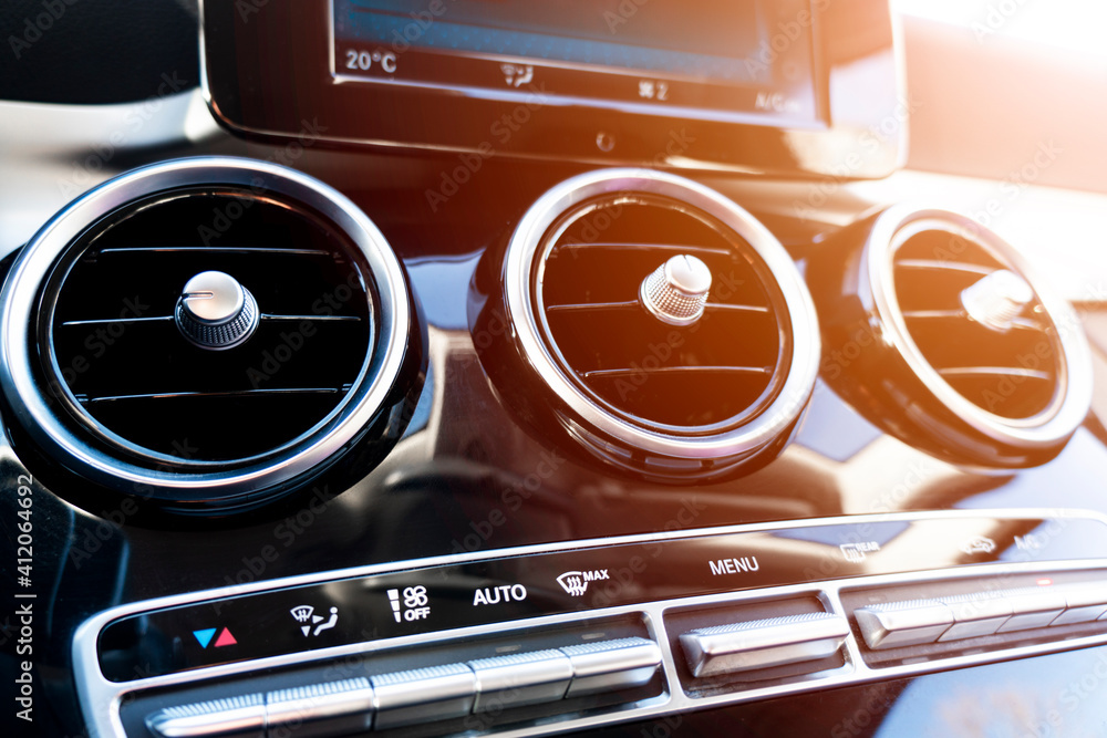 AC ventilation deck in luxury modern car Interior. Modern car black ...