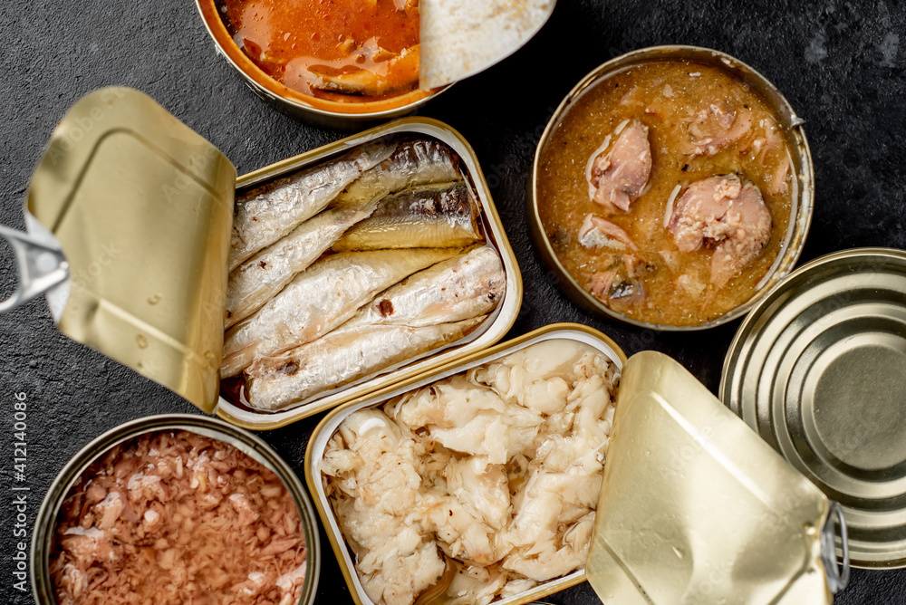 Assortment of canned food cans with different types of fish Salmon ...