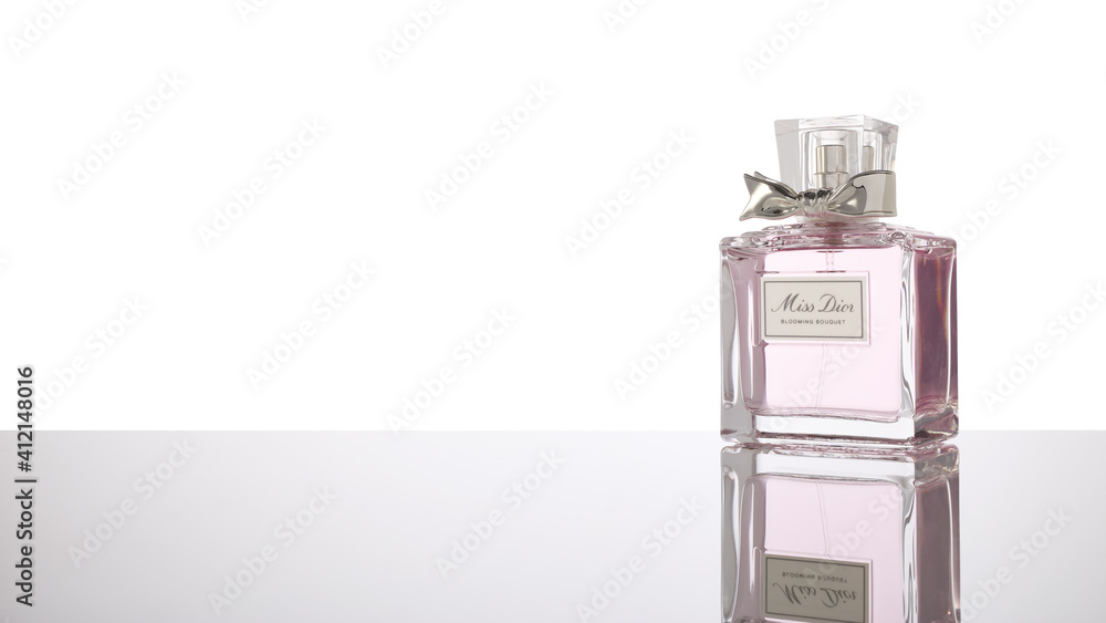 Bottle of perfume Miss Dior Blooming bouquet on white background ...