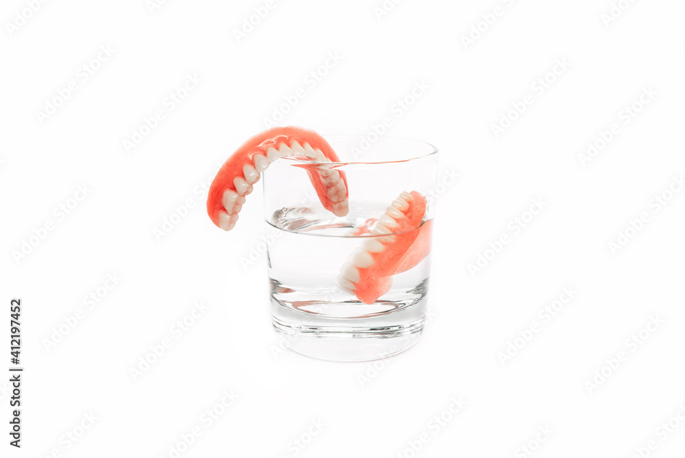 Dental prosthesis care. Full removable plastic denture of the jaws. A ...
