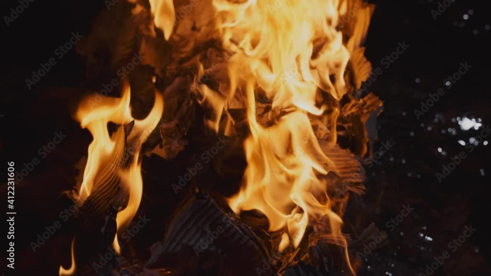 Burning flames on the ground. Campfire in the city, night scene. Flames ...