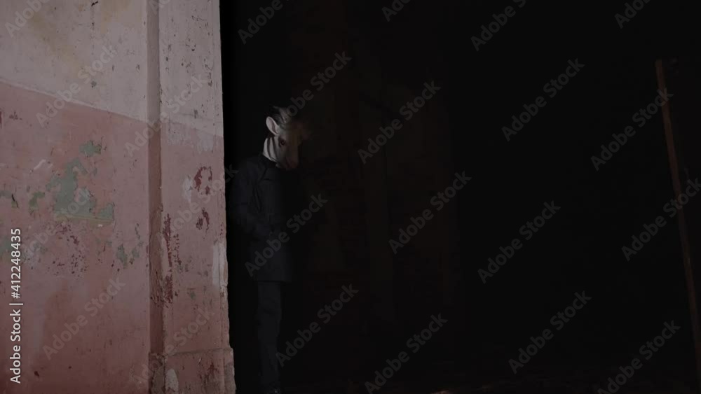 Vídeo do Stock: Scary man in the shadow. Abandoned, ruined building with a strange maniac inside ...