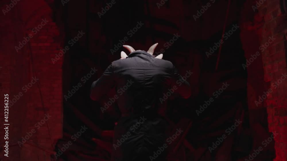 Scary, masked stranger waiting in the dark. Eerie, horror scene with a ...