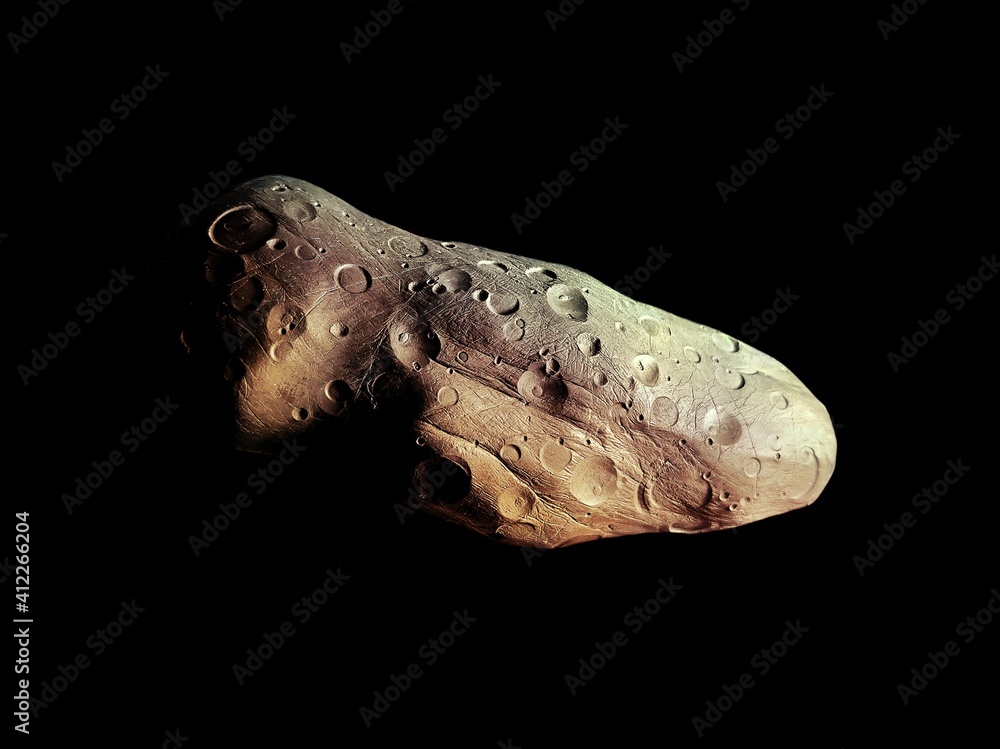 Asteroid isolated on a black background, surface of the meteorite ...