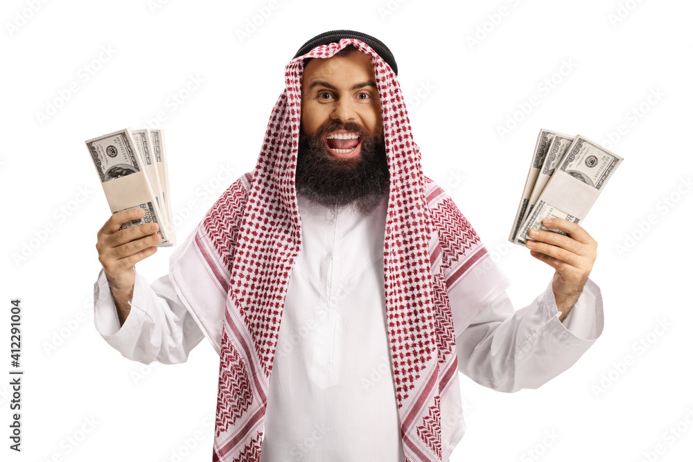 Excited saudi arab man holding stacks of money foto de Stock | Adobe Stock