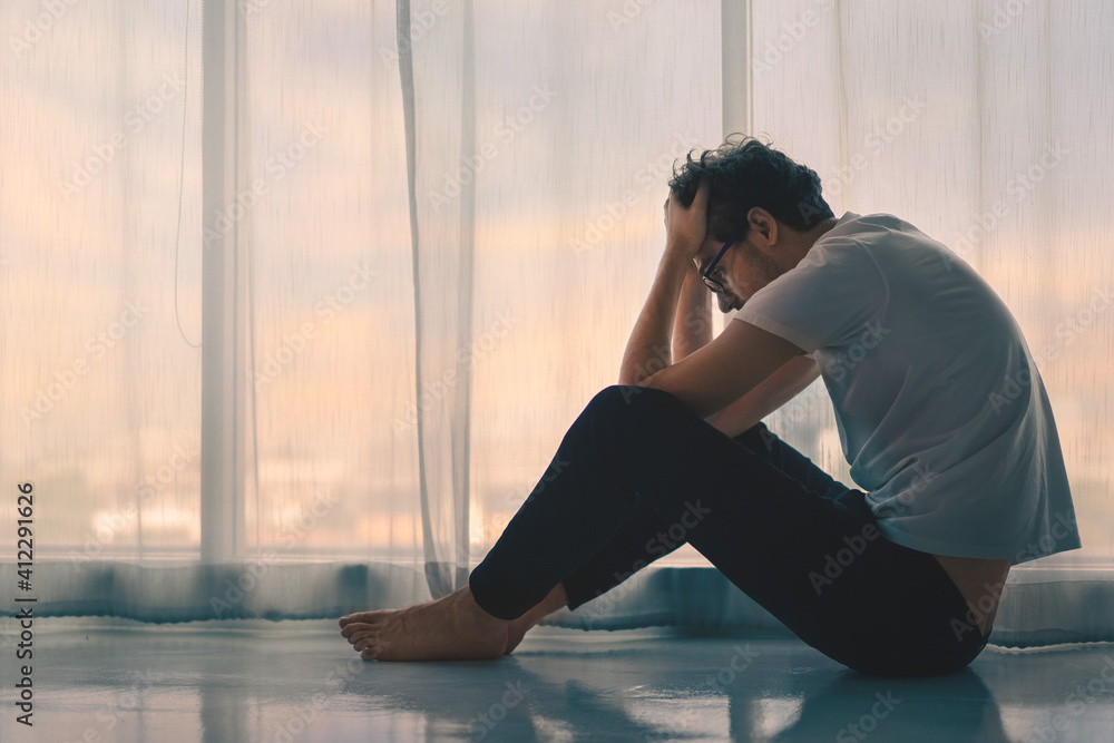 Depressed caucasian man losing job and heartbroken at same time sitting ...