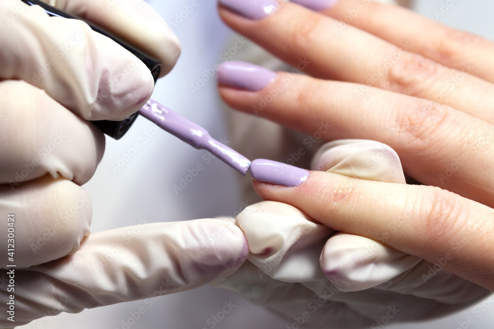 The process of manicure fitting natural nails filing nails coating with ...