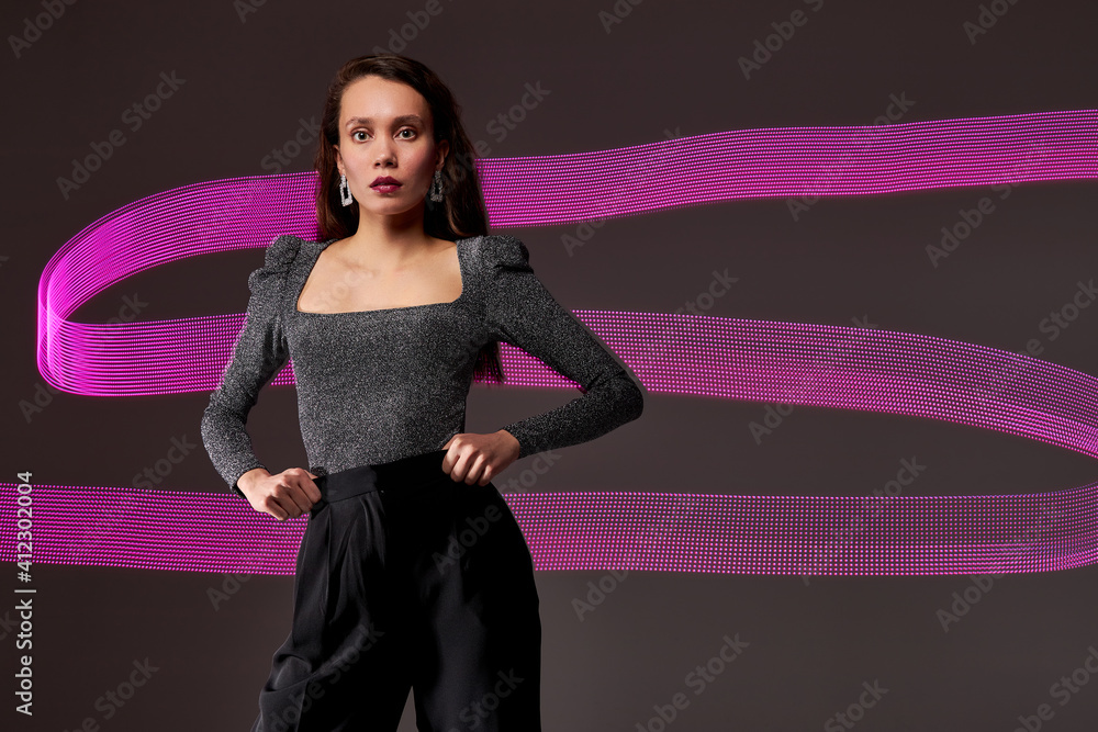 slim model against the backdrop of purple freezelight lines, attractive ...
