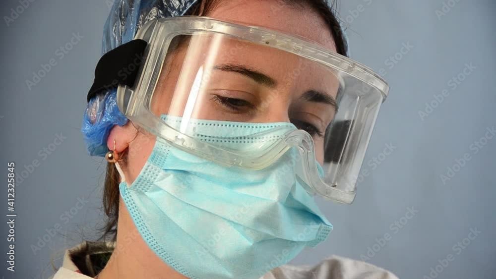 Doctor's face during coronavirus. Doctors fight against the coronavirus ...