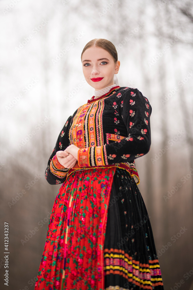 Young beautiful slovak woman in traditional dress. Slovak folklore ...