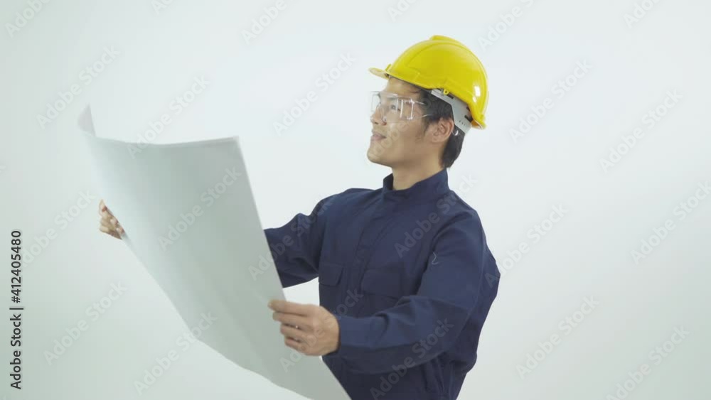 Portrait of young Asian engineer man worker with safety uniform helmet ...