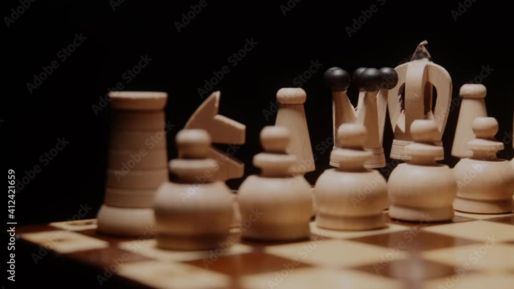 Chess pieces prepared for a game, chess figures on black background ...