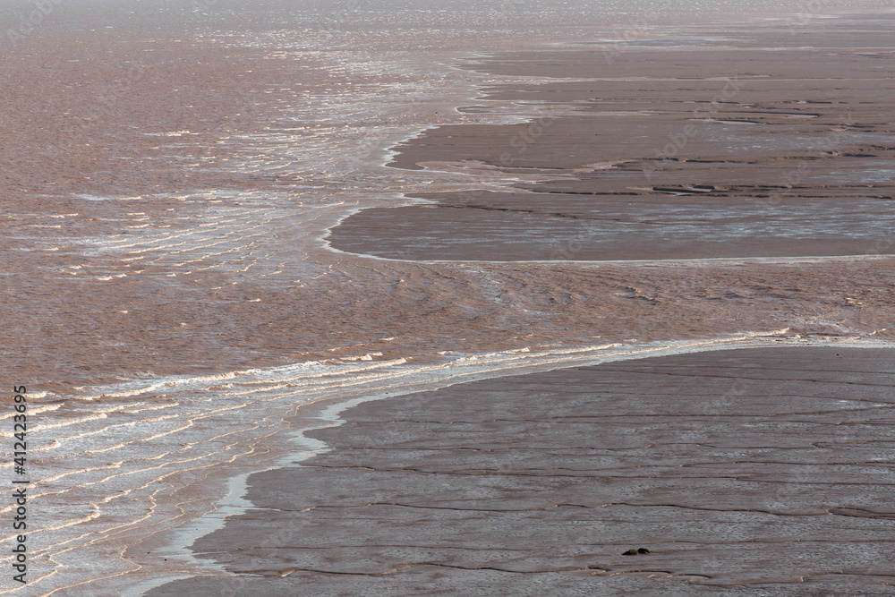 Sediment in moving water on Bay of Fundy during tide change Stock Photo ...