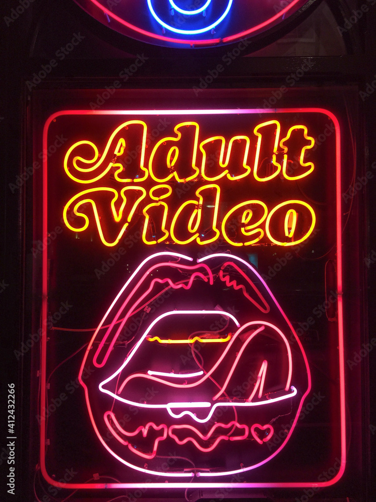 Neon signs lit at night Stock Photo | Adobe Stock