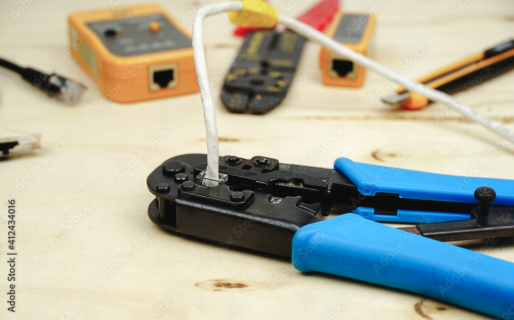 internet or telephone line cables and crimper, Twisting Cable Tool ...