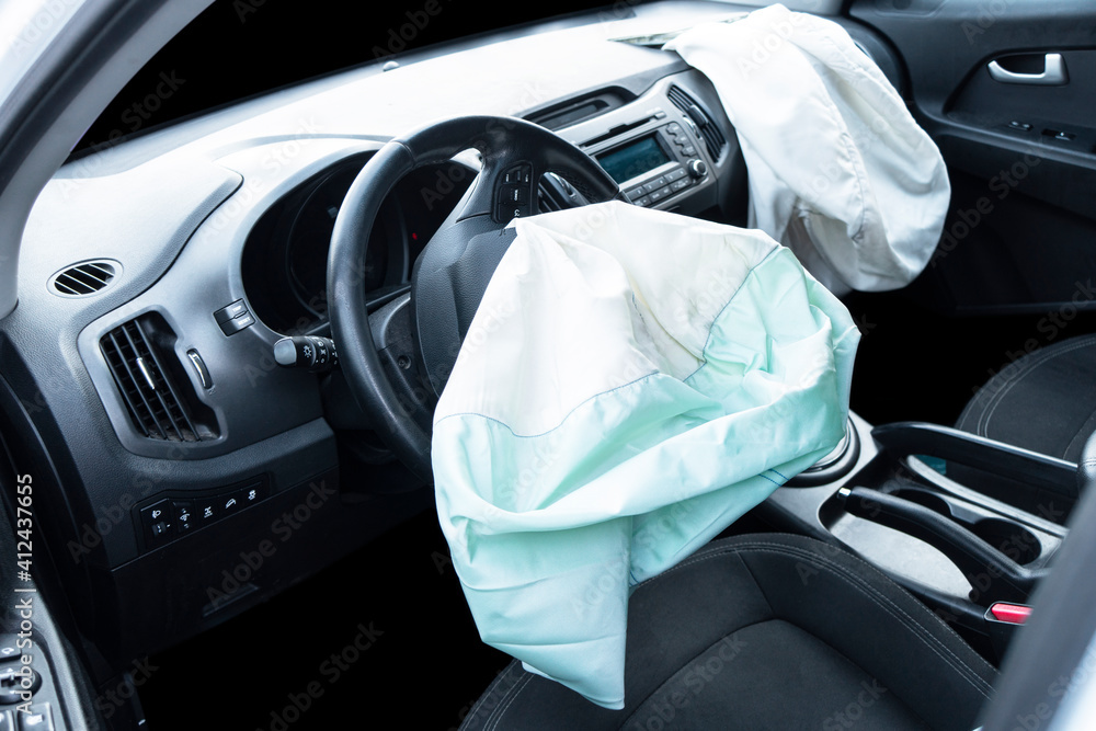 Airbag exploded at a car after the accident. Driver and Passenger ...