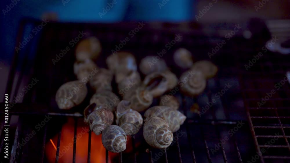 Fresh Sea shell grill with fire and smoke. Concept seafood bar and ...