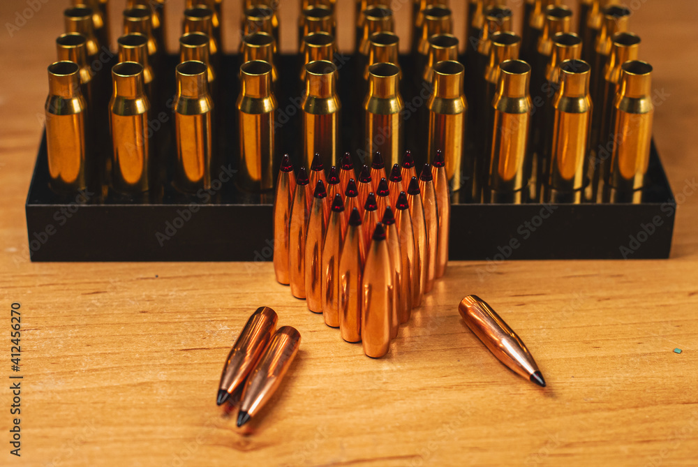 Portrait shooting of bullets with a red ballistic tip, the main focus ...