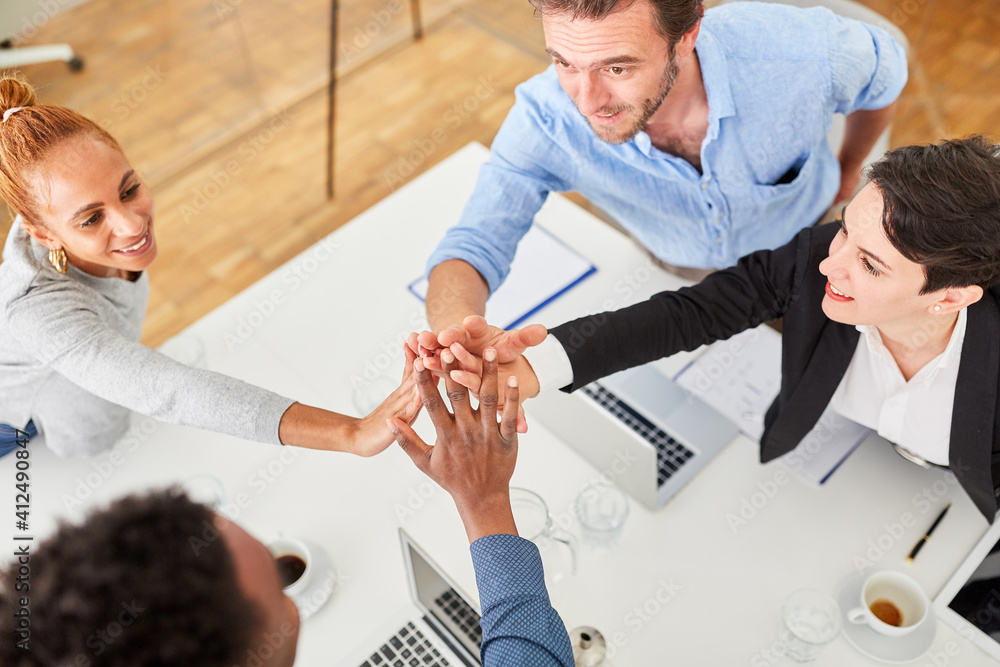 Successful start-up team gives itself a high five Stock Photo | Adobe Stock