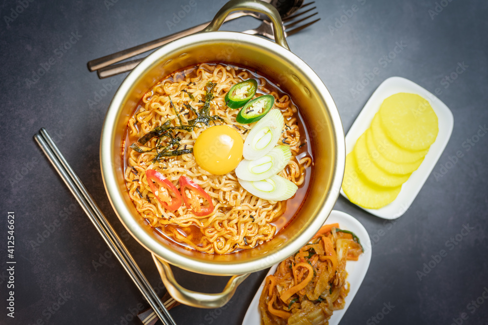 Korean style instant noodle, Ramyeon with egg yolk, chilli, kimchi ...