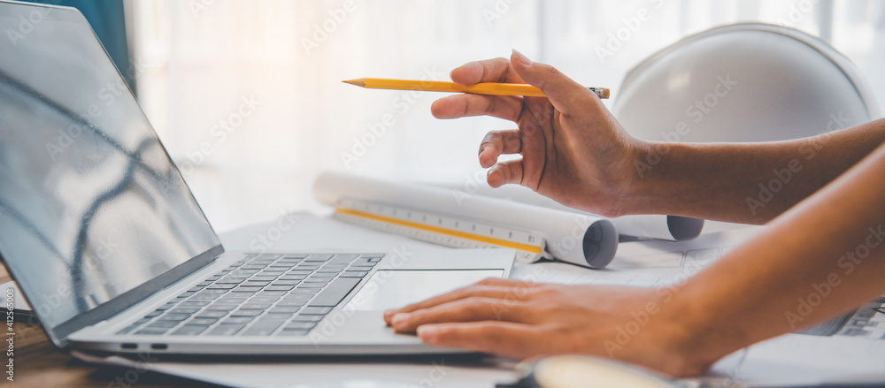 engineer working in office with blueprints, inspection in workplace for ...