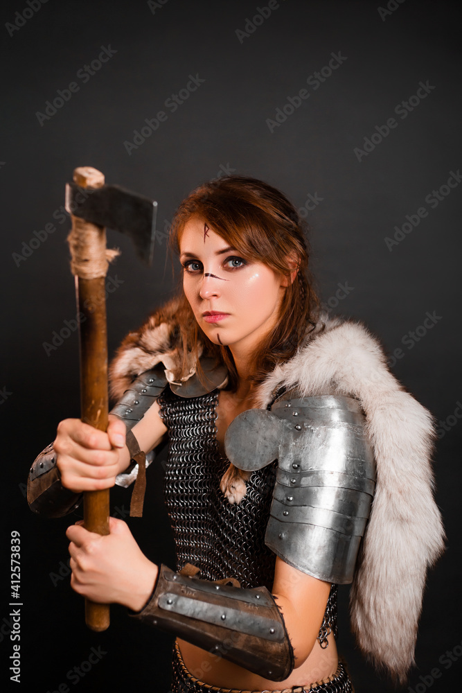 Woman warrior in chain mail armor with lamellar bracers and plate ...