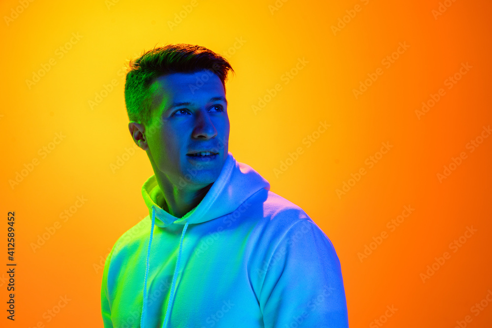 Dreamful. Caucasian man's portrait isolated on yellow studio background ...