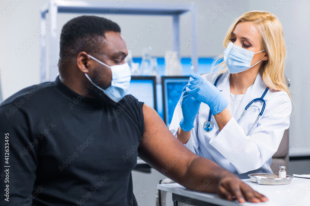 Professional doctor makes a coronavirus vaccine using a syringe and ...