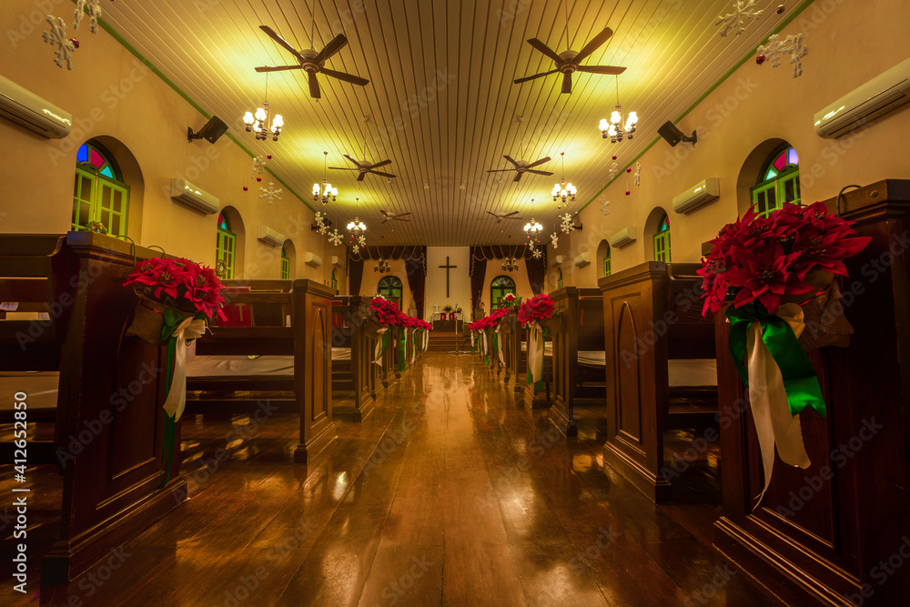 Beautiful interior view of little country church with empty wooden pews ...