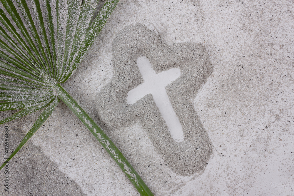 Ash Wednesday and Lent concept. Christian Cross drawing in ash with ...