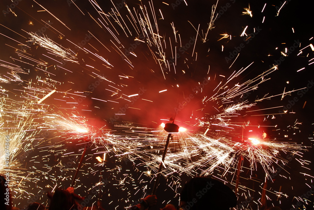 People playing with pyrotechnics in the street at a village. People ...